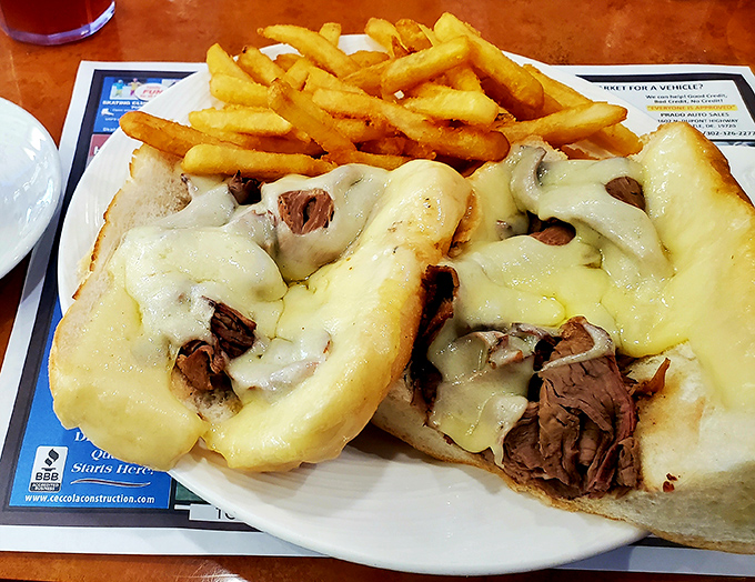 Behold the cheesesteak in all its glory – tender beef and melted cheese embracing each other on a perfect roll. This isn't just lunch; it's an experience.