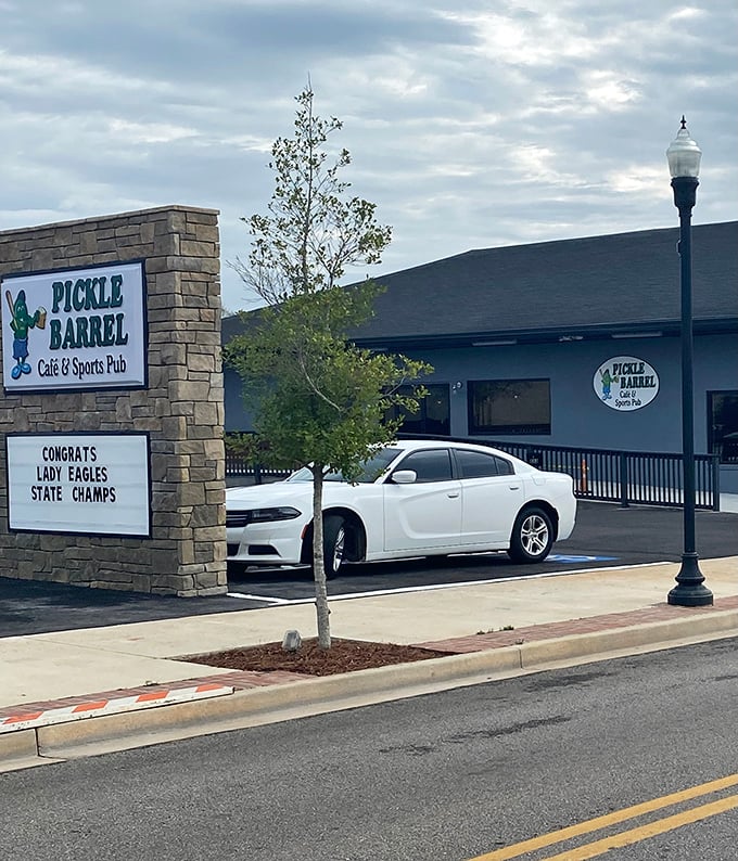 The Pickle Barrel Café & Sports Pub doesn't just serve food—it serves community spirit, proudly celebrating local victories on its marquee.
