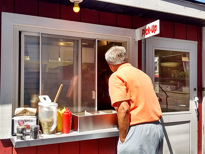 Where hopes and dreams are exchanged for paper-wrapped bundles of joy. The pickup window—Wisconsin's version of a drive-through Louvre.
