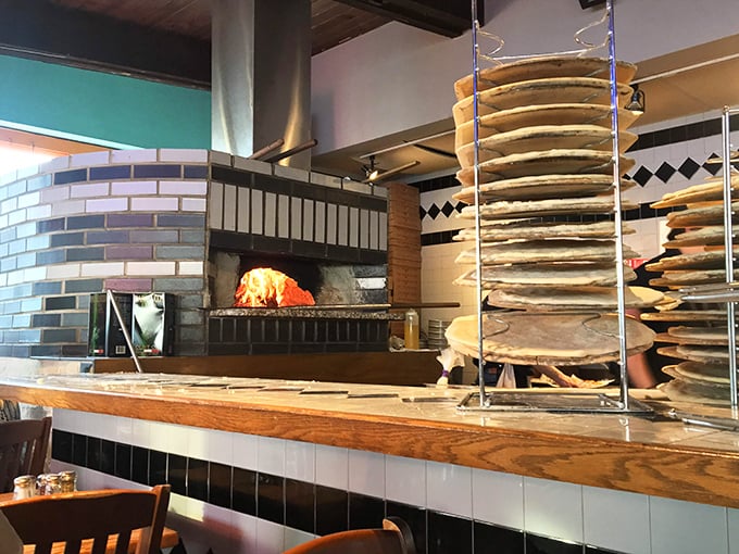 The wood-fired oven – the beating heart of Faccia Luna – where dough transforms into pizza magic before your very eyes.