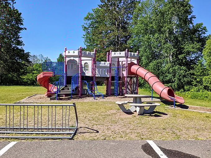 This castle-themed playground invites young adventurers to conquer slides and towers while parents enjoy a moment of Northwoods tranquility.