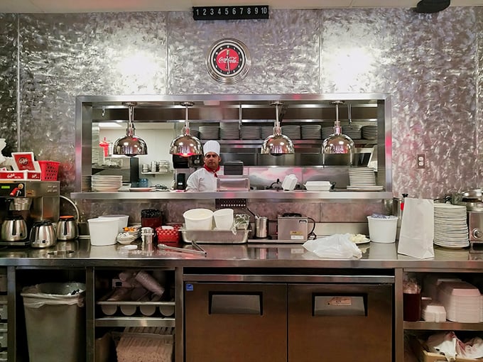 Behind the scenes, where the magic happens – stainless steel, focus, and the organized chaos that somehow results in your perfect breakfast.