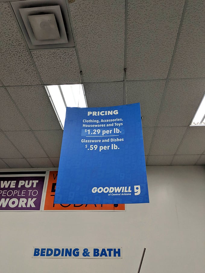 The pricing sign that launches a thousand bargain hunts. At $1.29 per pound, you're essentially buying clothes for the price of potatoes.