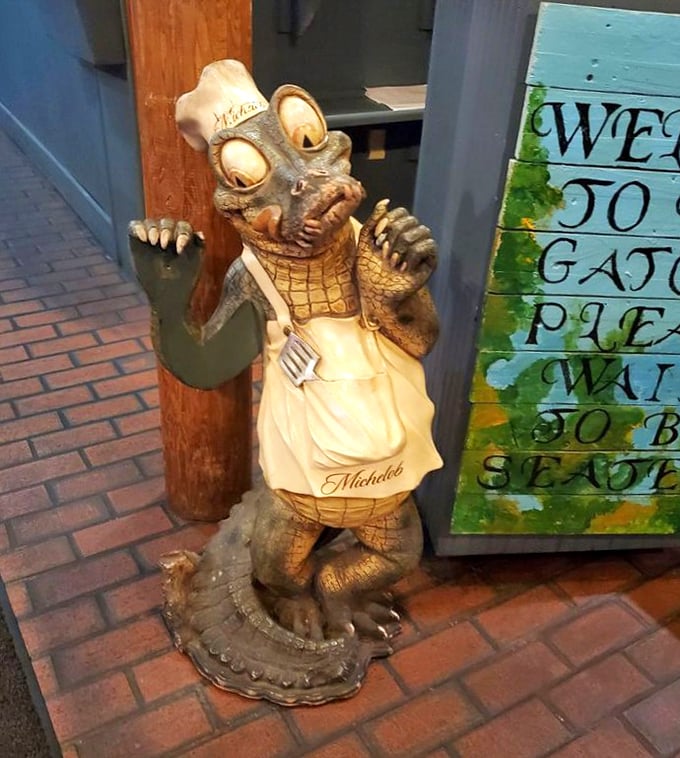 Meet the restaurant's unofficial greeter—a chef gator statue who's been witnessing first dates, family celebrations, and wing cravings for years.