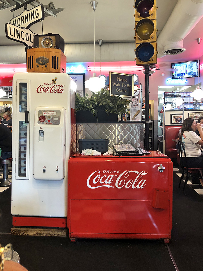 Vintage Coca-Cola machines and traffic lights aren't just decoration—they're time capsules from when diners were America's living rooms with better coffee.
