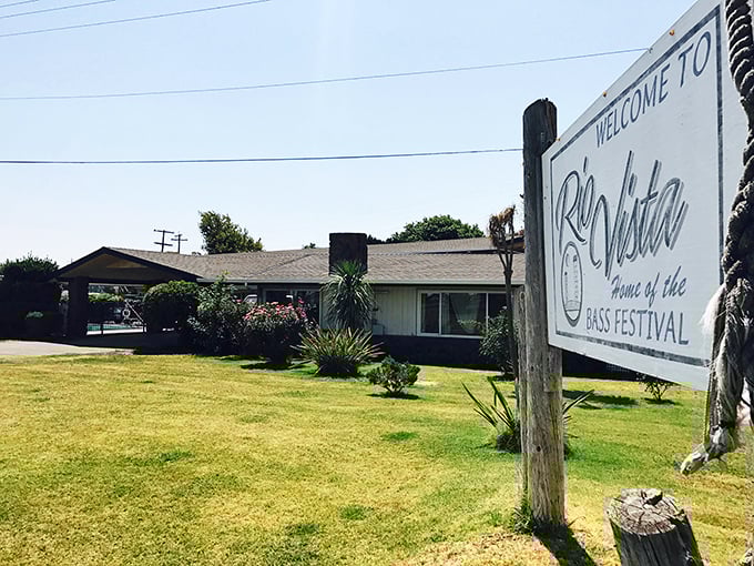 Welcome signs like this one don't just mark town boundaries—they're the first handshake in a friendship with a place that values bass and hospitality equally.