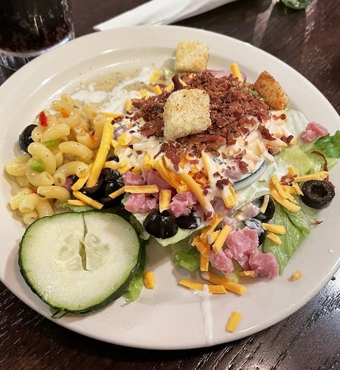 A salad that doesn't apologize for being a salad, brightened with cheese, ham, and croutons—because even healthy choices deserve a little fun.