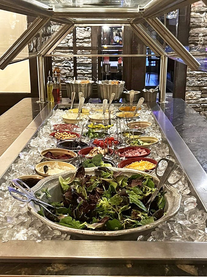 The salad bar—where health-conscious diners and those seeking pre-steak roughage can customize their vegetable experience with military precision.