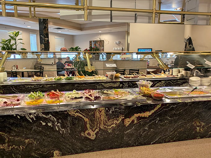 A salad bar that proves vegetables can be exciting when presented with this much marble-countered grandeur.