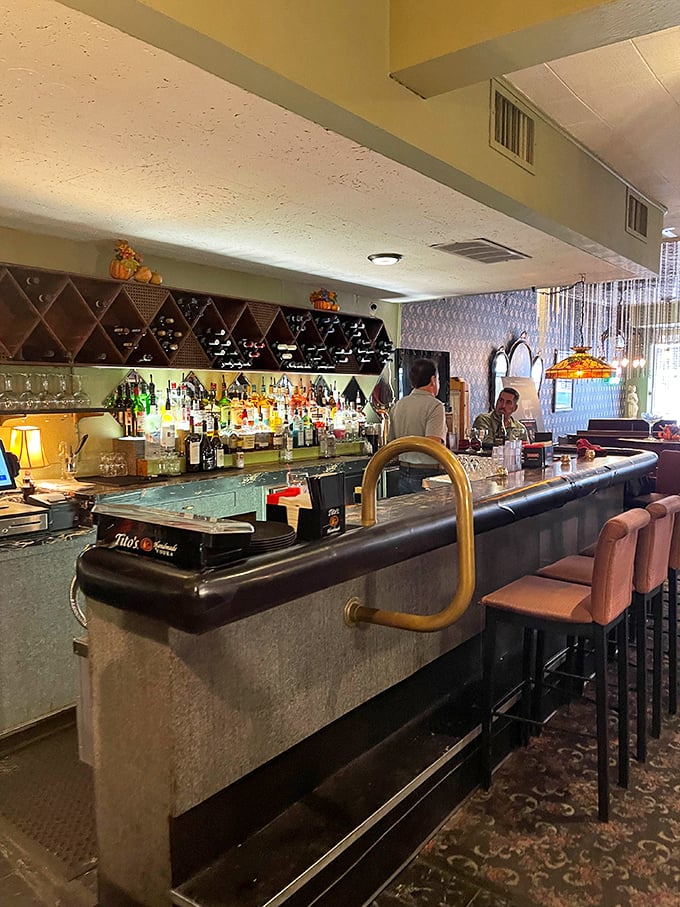 Pink bar stools invite you to sidle up for an aperitivo – the perfect prelude to the Italian feast that awaits.