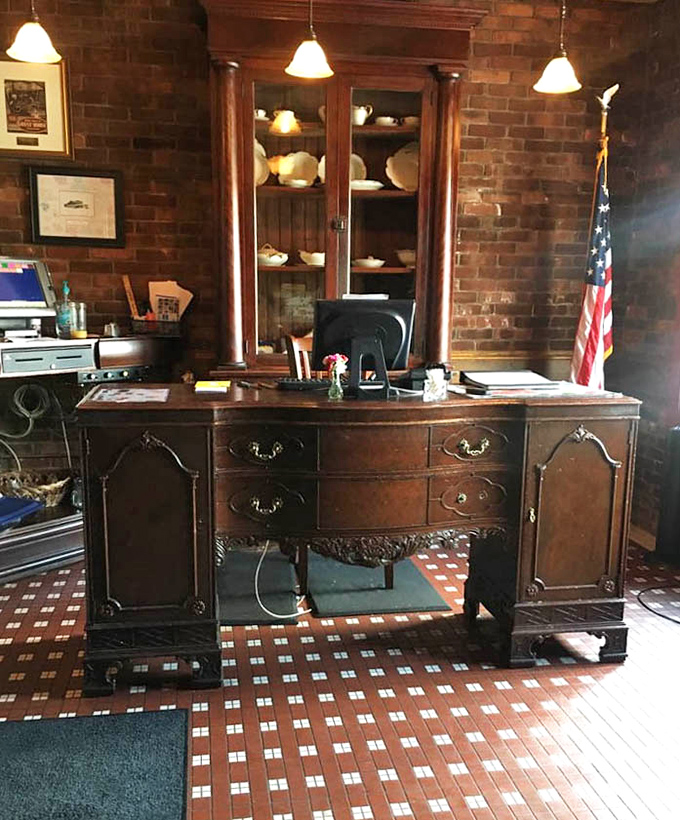 The antique desk serving as host station isn't just furniture—it's a time machine to an era when craftsmanship mattered.