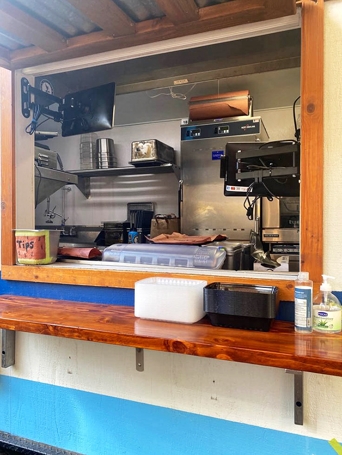 The service window—where anticipation meets fulfillment. That wooden counter has witnessed countless first-bite expressions of pure joy.