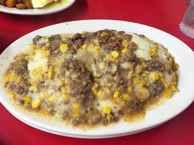 This isn't just Shepherd's Pie – it's a mountain of comfort topped with melted cheese and sweet corn, the kind of meal that makes you cancel afternoon plans.