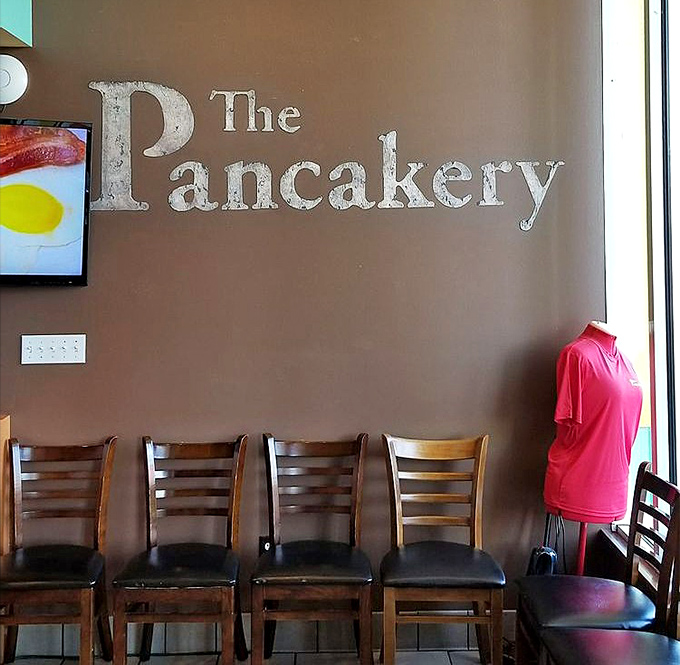 The restaurant's name emblazoned on the wall serves as both decoration and promise—this place takes its pancake responsibility seriously.