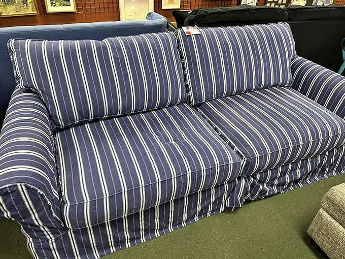 This blue striped sofa has seen better days, but with the right home and maybe a throw pillow or two, it's ready for its second act.