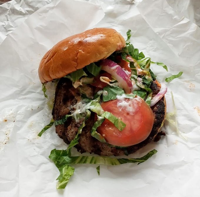 This isn't just a burger – it's a spicy buffalo revelation topped with fresh veggies that somehow makes you feel virtuous while indulging completely.