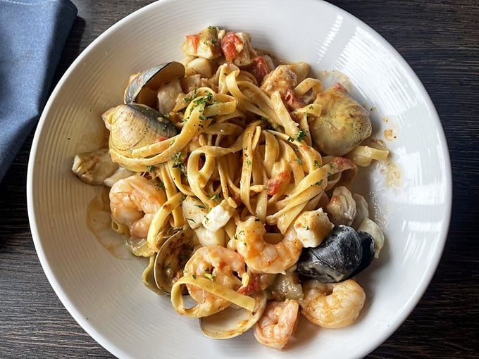 Spicy seafood pasta that's like an underwater party where everyone showed up—shrimp, clams, and mussels mingling in that vibrant sauce.