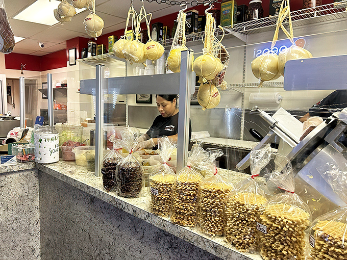 Behind every great sandwich is a dedicated team. The deli counter dance—where efficiency meets artistry in the hands of skilled sandwich architects.