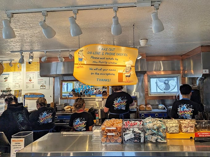 The pickup counter—where names are called and dreams come true. Those staff shirts have seen thousands of "first bite" faces.