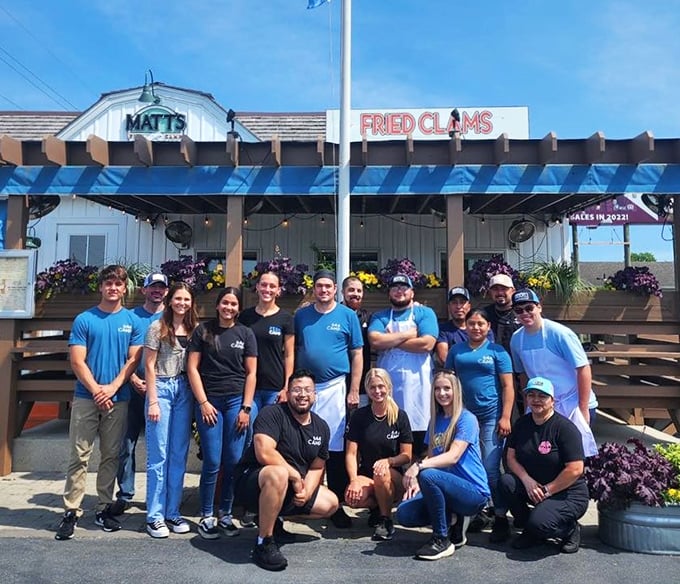 The team behind the magic—proof that great seafood requires both skill and the kind of smiles that suggest they know exactly what they're serving.