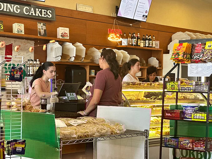 Behind the counter, the staff orchestrates a symphony of sweet service, their movements as practiced and precise as veteran conductors.