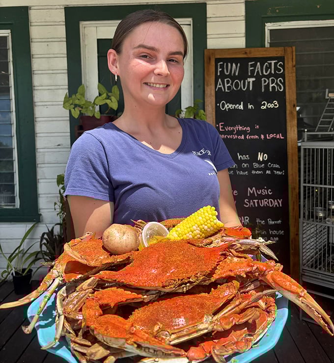 That mountain of seasoned blue crabs isn't just dinner—it's an event, a celebration, and possibly the reason stretchy pants were invented.