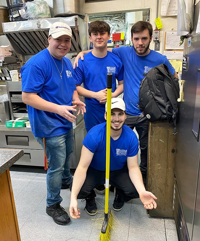 Behind every great seafood joint is a dedicated crew—these blue-shirted kitchen warriors ensure your fish is fresh and your experience memorable.