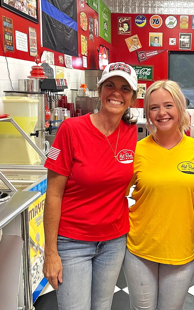 The smiles of diner staff who know they're serving happiness, not just food. Their t-shirts match the walls—commitment to theme!