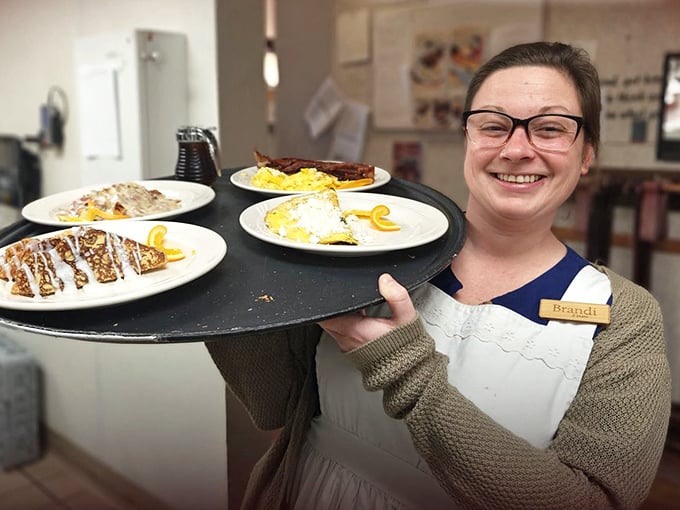 The smile says it all—when your server looks this happy about the food they're carrying, you know you're in for something special.