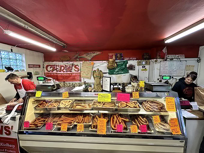 The smokehouse—where magic happens. Rows of fresh kielbasa waiting to be transformed by time, smoke, and generations of expertise.