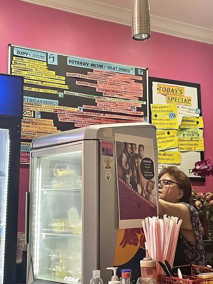 The menu board showcases a rainbow of Polish specialties, each handwritten card promising a different path to culinary bliss.