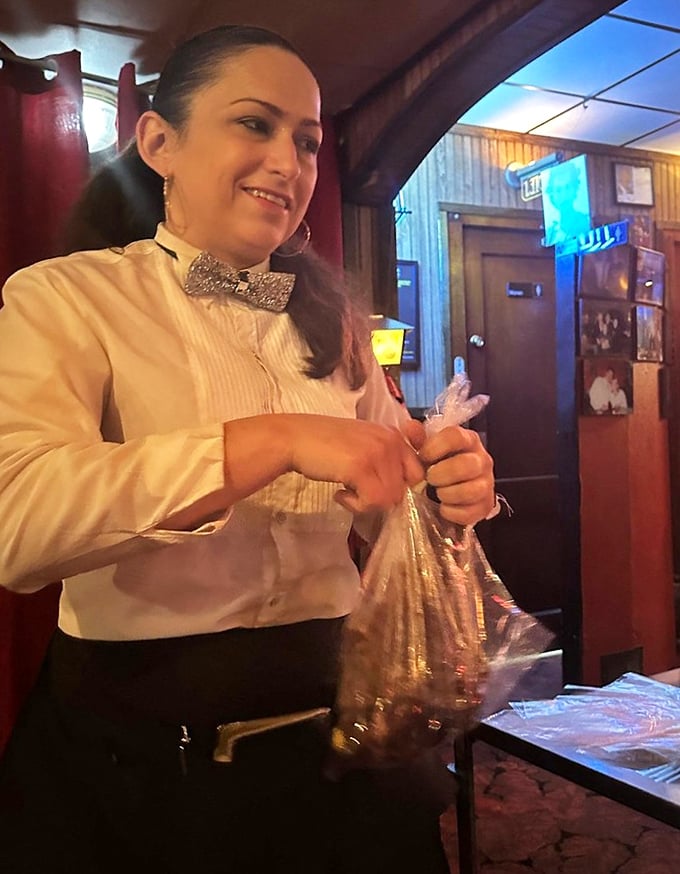 Servers dress in classic white shirts and bow ties, carrying on traditions of hospitality that predate modern restaurant trends by decades.