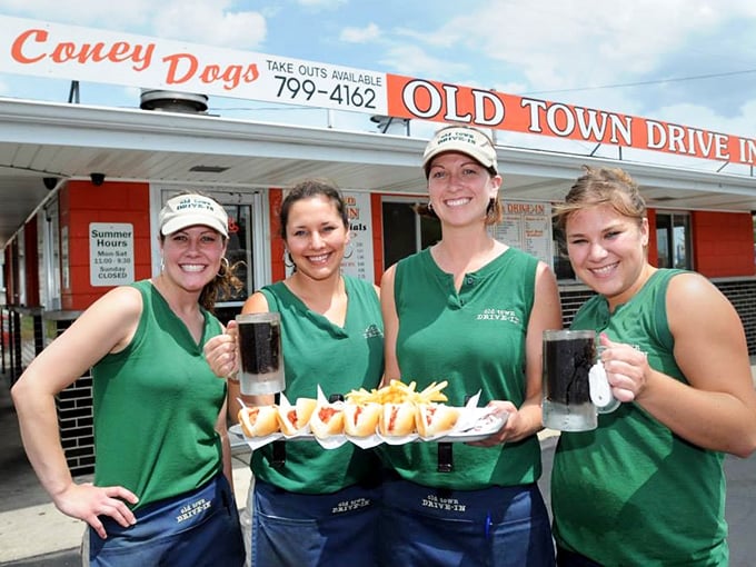Friendly faces serving up smiles alongside that legendary root beer—customer service from a gentler, better era.