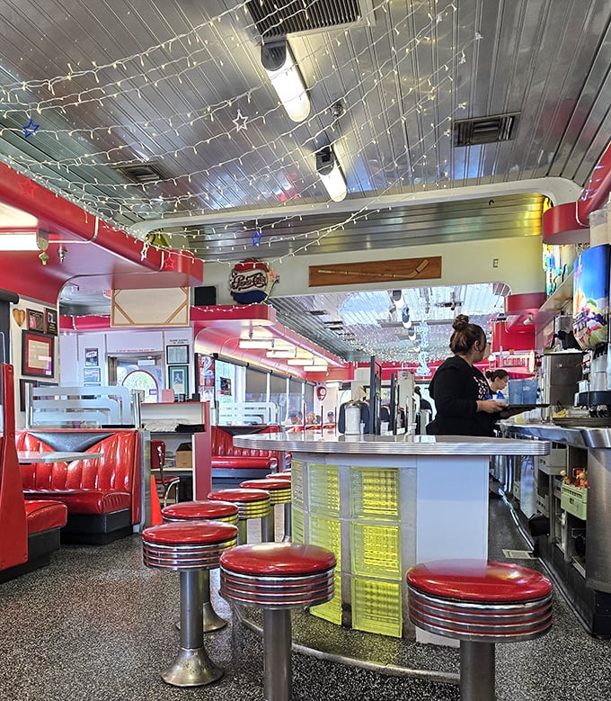 Those yellow glass blocks behind the counter stools aren't just decorative—they're time machines to when diners were the social media of their day.