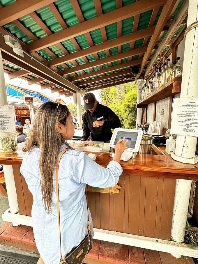 That moment when you're ordering but already mentally consuming everything on the menu—a universal Harbor Cafe experience.