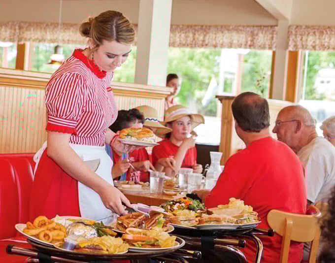 The servers in their cherry-red uniforms aren't just bringing food—they're delivering memories that will outlast your diet resolutions.
