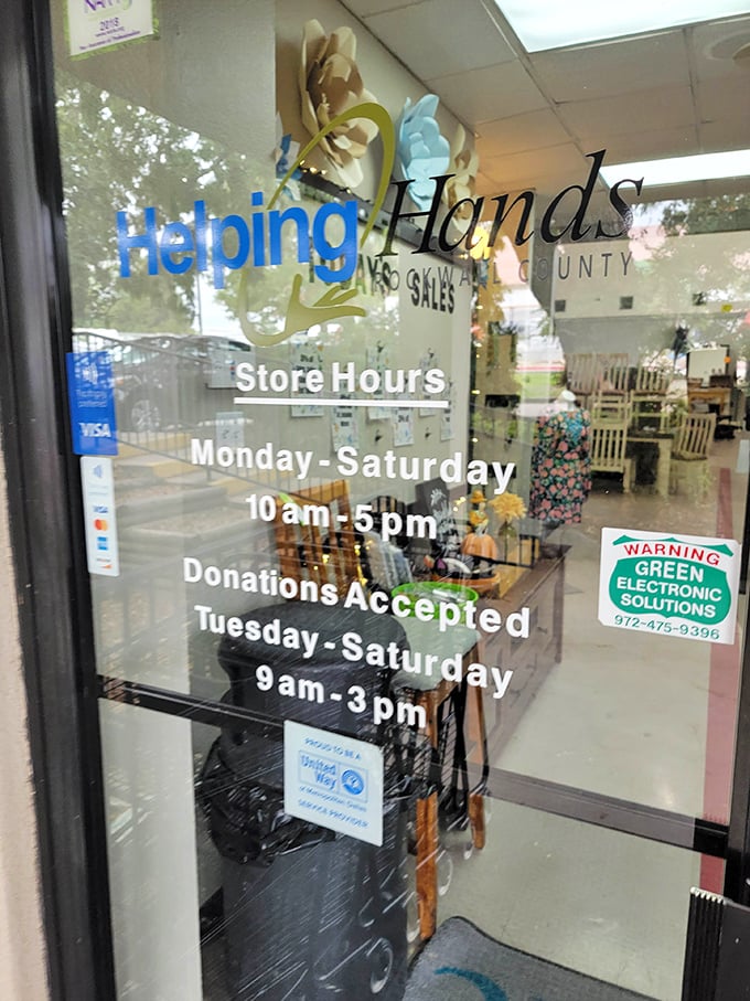 The storefront reveals the magic hours—10am to 5pm, six days a week—when bargain hunters can pursue their passion for previously-loved treasures.