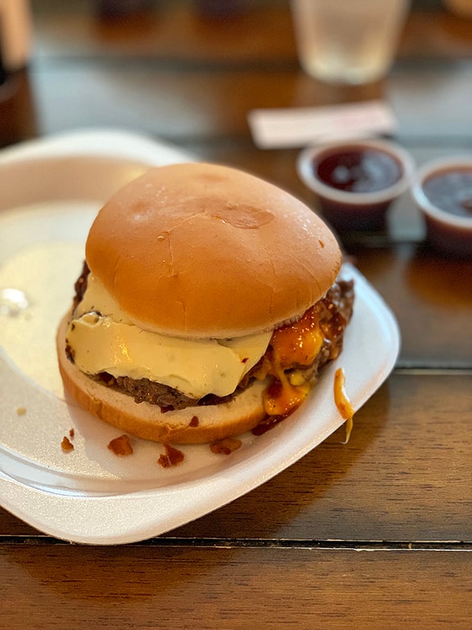 This burger has more layers than your favorite Netflix drama. The cheese pull alone deserves its own Instagram account.