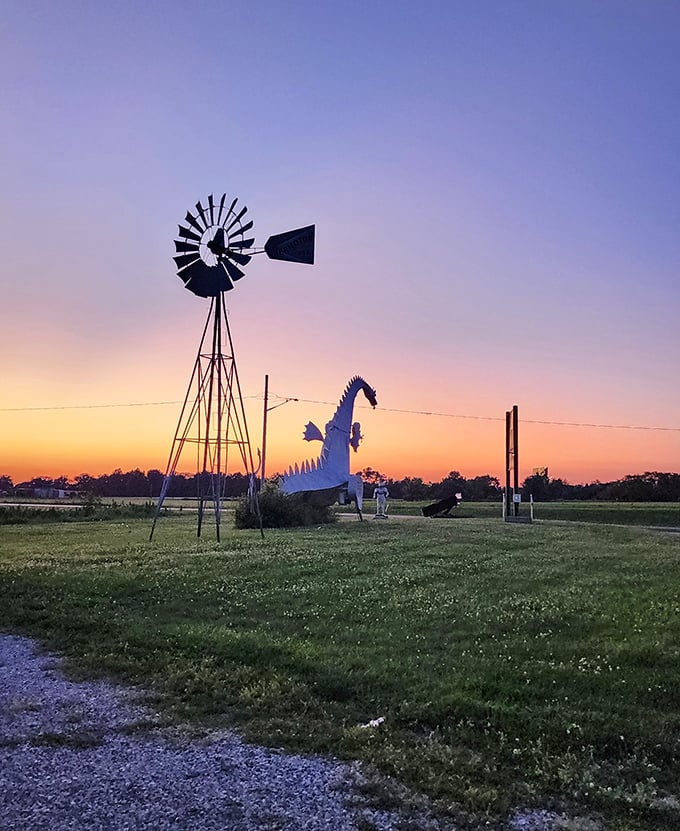 Magic hour at the dragon's lair. Sunset casts a golden glow as the metal beast silhouettes against the fading Midwestern light.