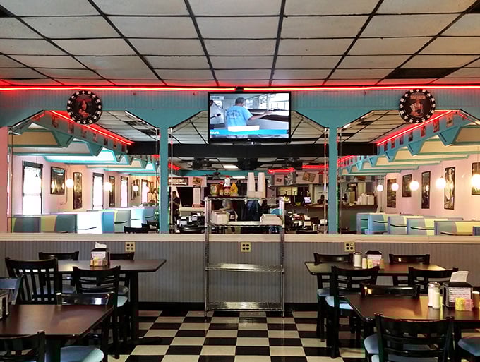 That classic diner TV—always showing something nobody's really watching, yet somehow essential to the ambiance as the neon lights.