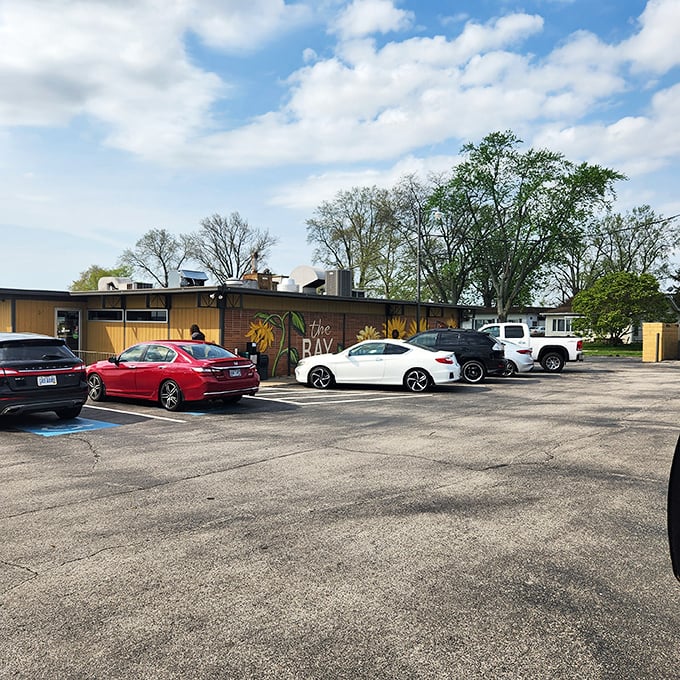 "The Bay" promises lakeside dining where the parking lot hints at local popularity—always trust a full lot when hunting for good food.