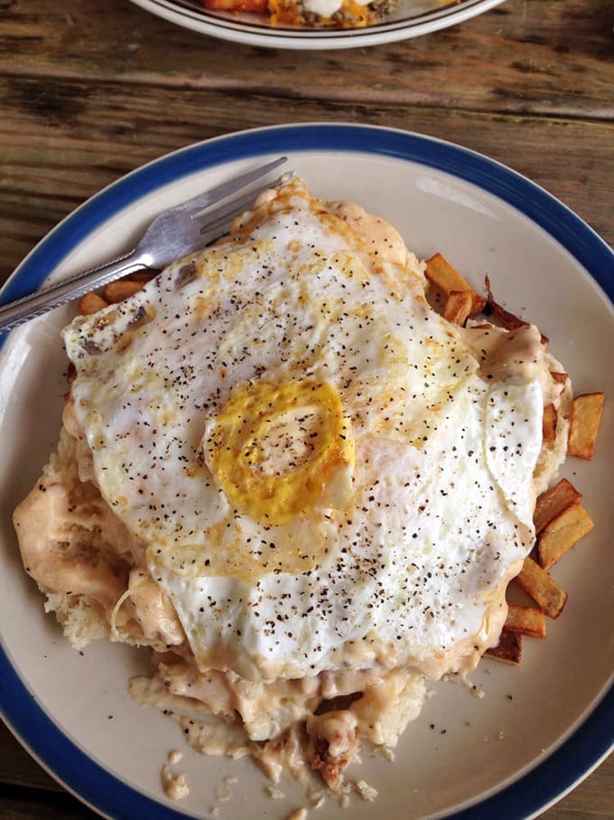 Morning glory on a plate! Crispy potatoes swimming in gravy with perfectly cooked eggs—this is what breakfast champions eat.