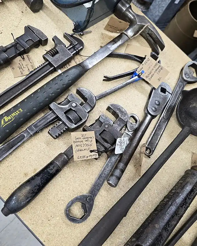 Tools with history in their handles—each wrench and hammer having fixed more problems than most modern relationships.