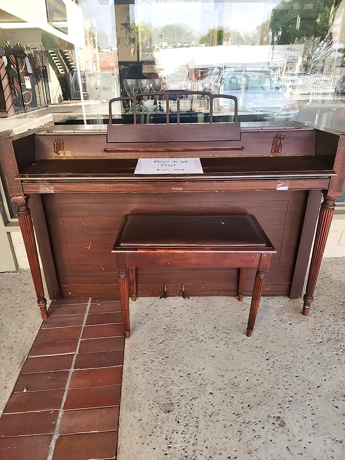 "Please do not play" reads the sign on this dignified piano – a musical centerpiece that's seen more homes than a traveling symphony.