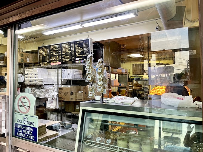 Where the magic happens—a glimpse into the kitchen reveals the organized chaos behind every perfect piece of chicken.