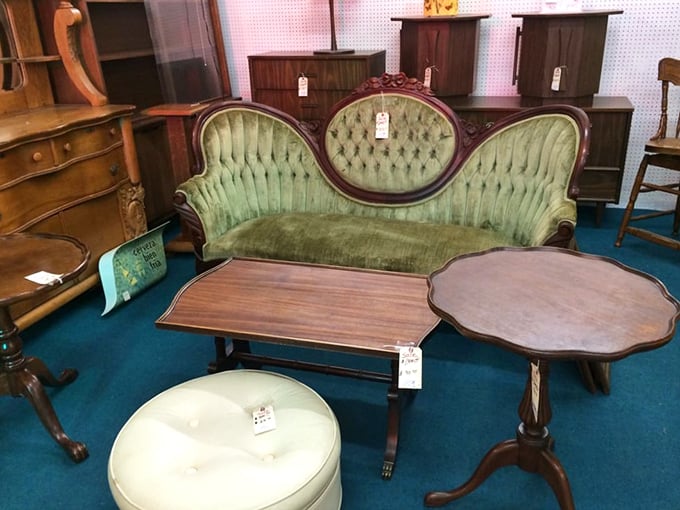 This green velvet Victorian sofa has hosted more conversations than a barbershop on Saturday morning.
