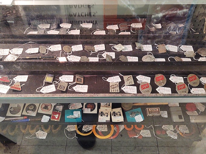 Vintage key tags and tokens from an era when hotel rooms actually used keys and gas stations gave out trinkets instead of apps.