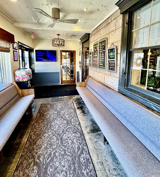 The waiting area isn't just functional—it's a prelude to comfort, with stone walls that have been welcoming hungry travelers for generations.