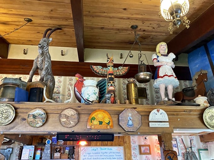 Alpine treasures line the shelves, including what appears to be a mountain goat statue standing guard over your breakfast experience.