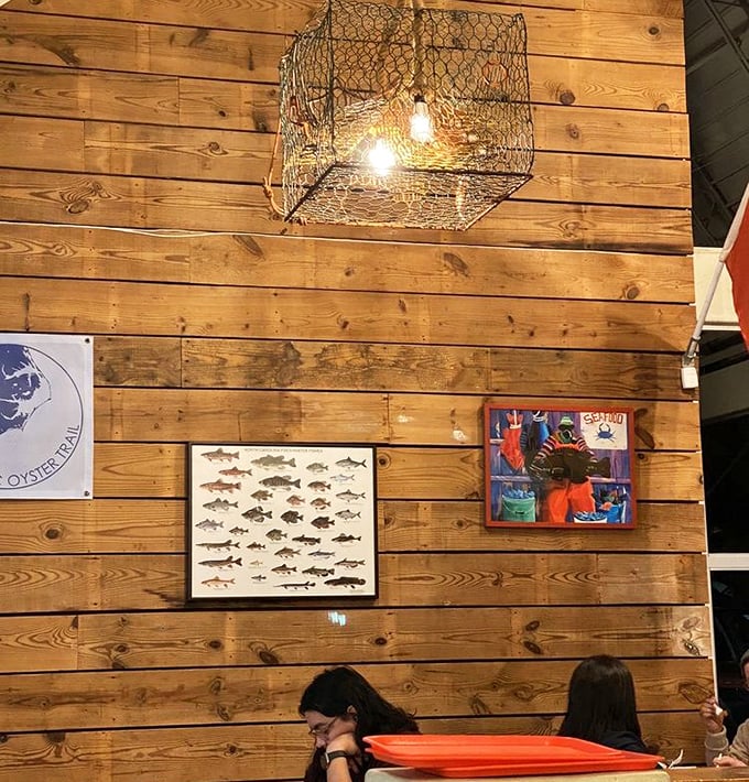 Those fishing net light fixtures aren't just decorative—they're a reminder of the direct line between North Carolina waters and your plate.